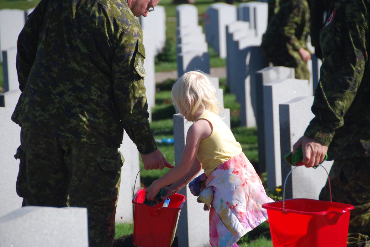 Headstone cleaning at National Military Cemetery draws hundreds of ...